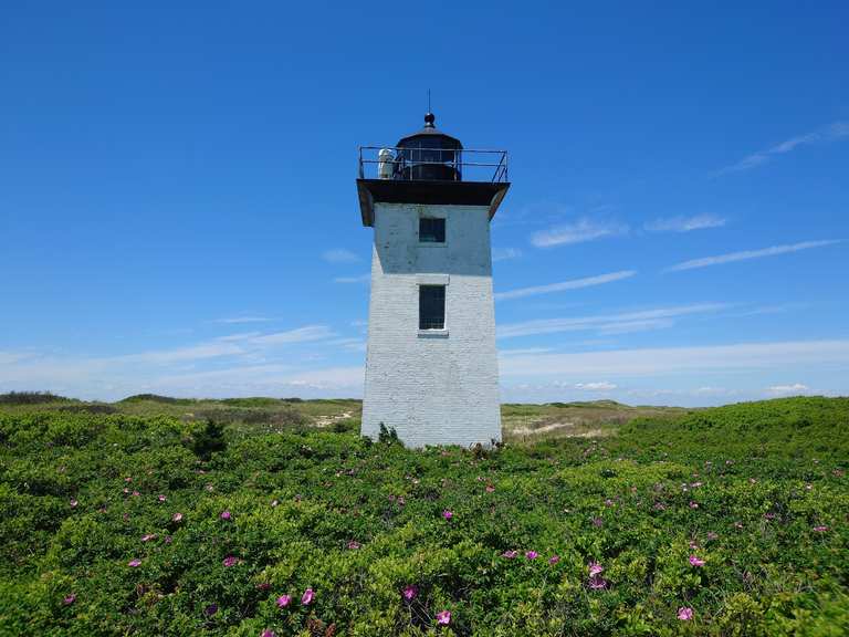 Farol de Long Point através do Quebra-mar — Cape Cod National Seashore ...