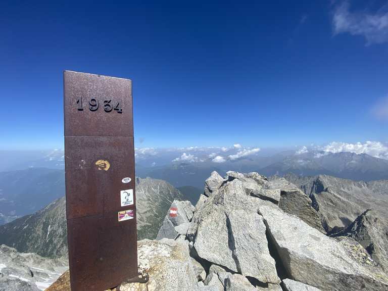 Alpine lake trail to Corno Baitone Summit from Rifugio Tonolini ...